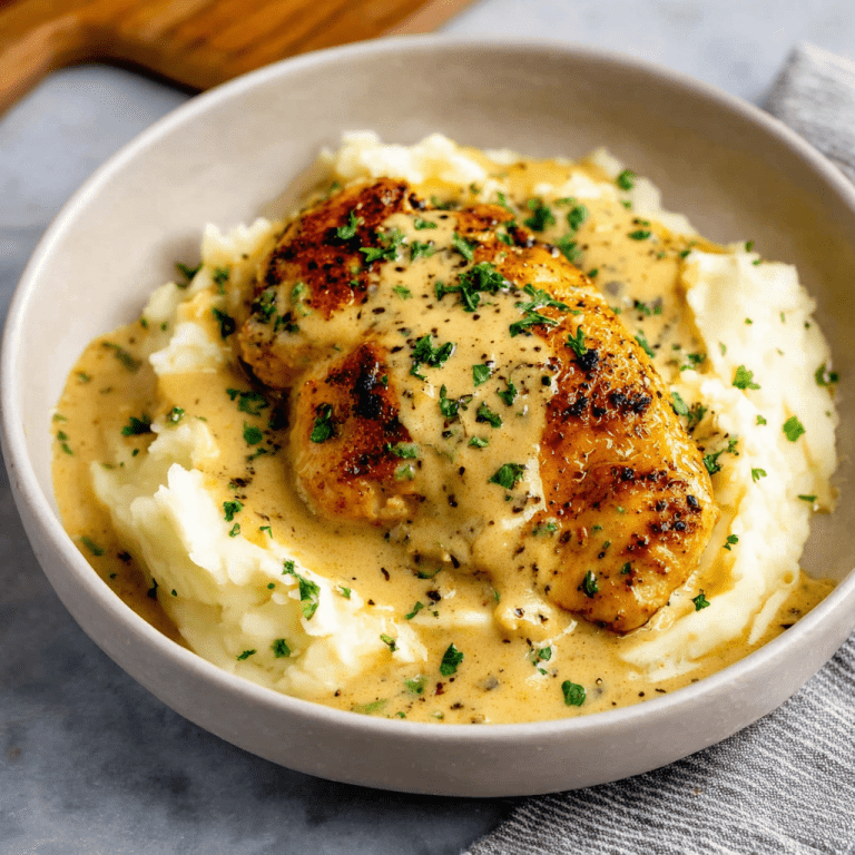 Tender Chicken Breasts in Creamy Dijon Mustard Sauce Over Fluffy Mashed ...